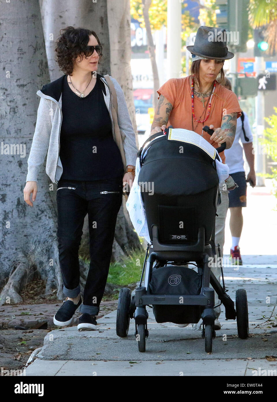 Sara Gilbert and wife Linda Perry take their newborn son Rhodes on a ...
