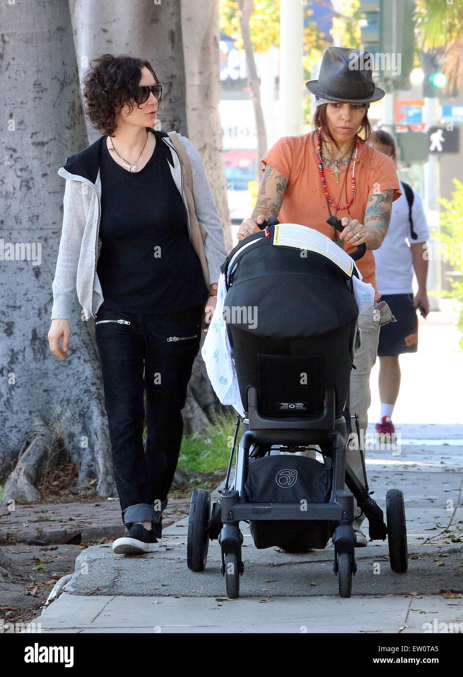 Sara Gilbert and wife Linda Perry take their newborn son Rhodes on a ...