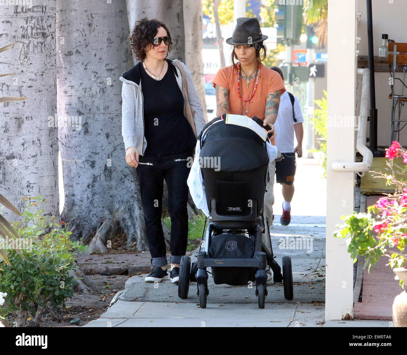 Sara Gilbert and wife Linda Perry take their newborn son Rhodes on a ...