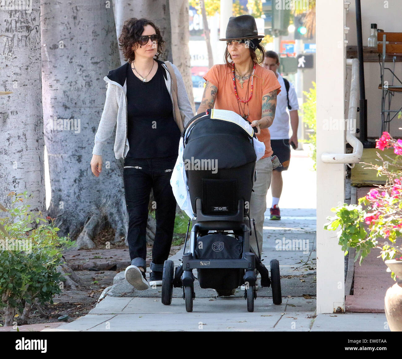 Sara Gilbert and wife Linda Perry take their newborn son Rhodes on a ...