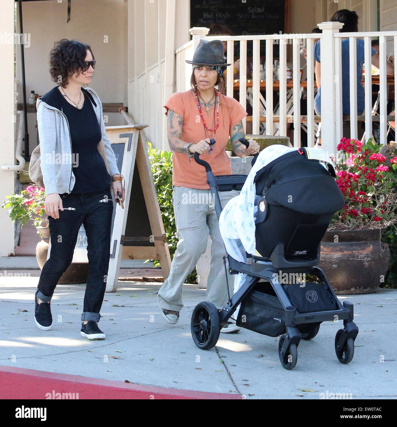 Sara Gilbert and wife Linda Perry take their newborn son Rhodes on a ...