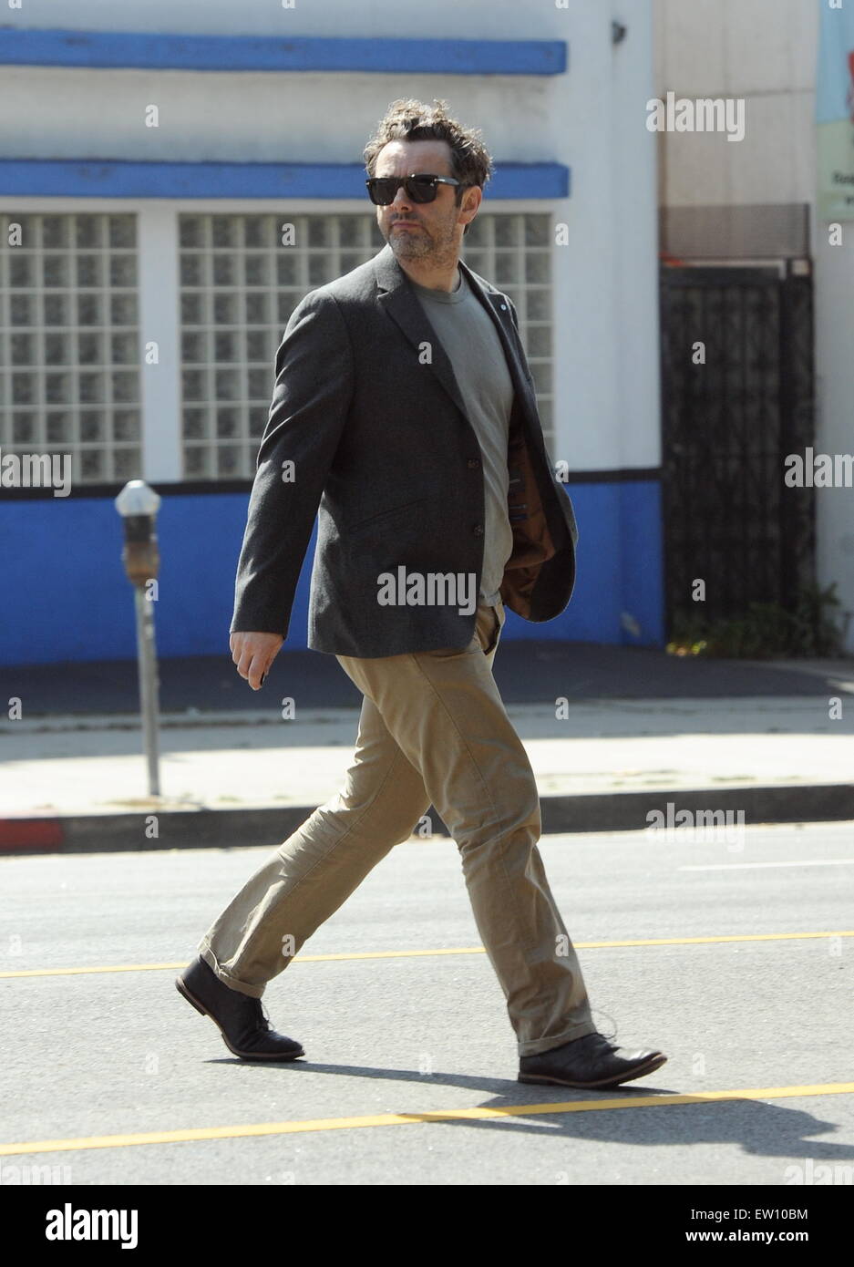 Actor Michael Sheen spotted jaywalking with a bad hair day after eating lunch at GC cafe in ...