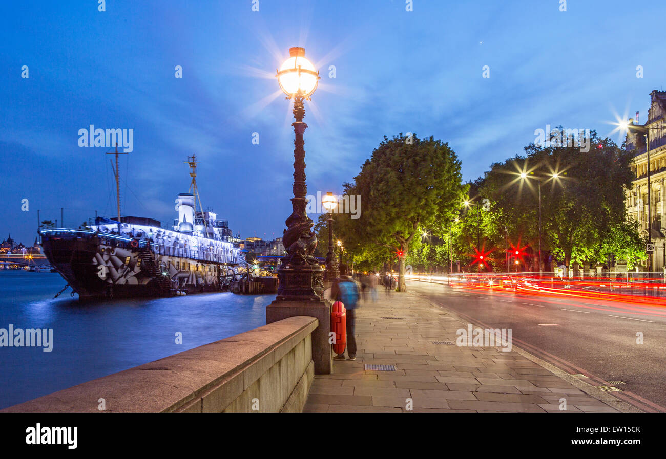 Victoria Embankment At Night With People and Boat London UK Stock Photo ...