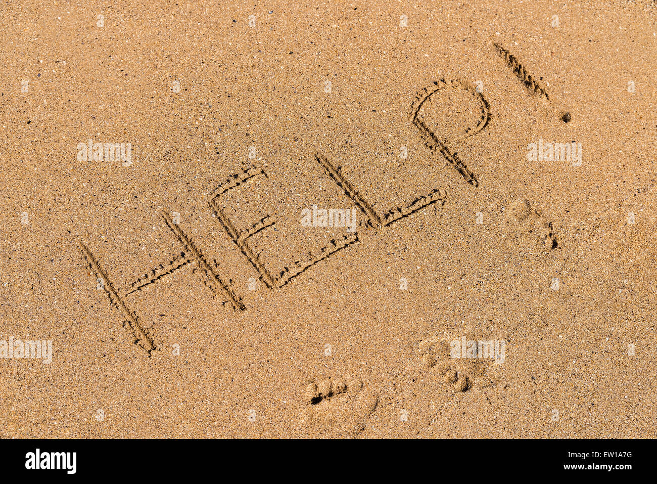 Help Sign Drawn On Beach Sand Stock Photo - Alamy