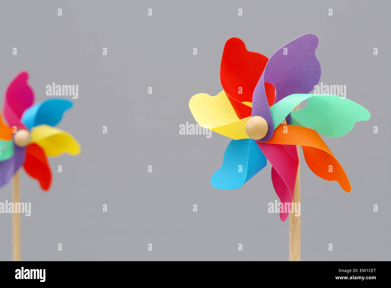 Colorful toy pinwheel on gray background Stock Photo - Alamy