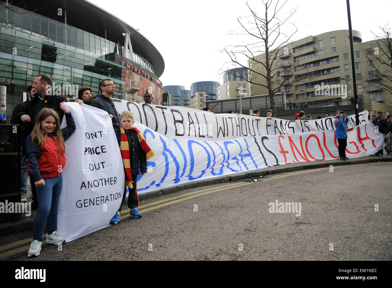 Football fans gather outside The Emirates Stadium before the match ...