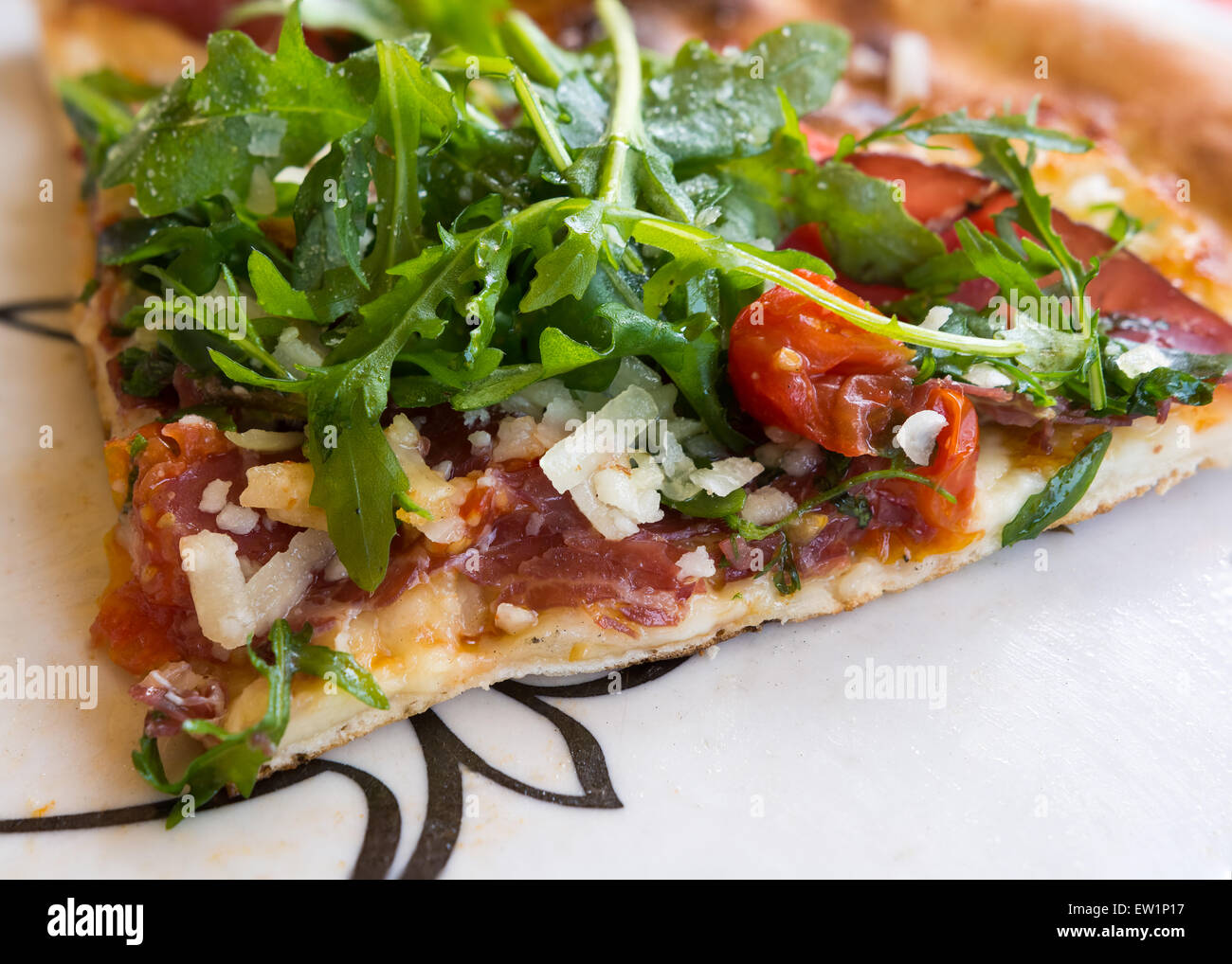 In the picture Italian pizza close-up with Argula,cherry tomato,tomato ...