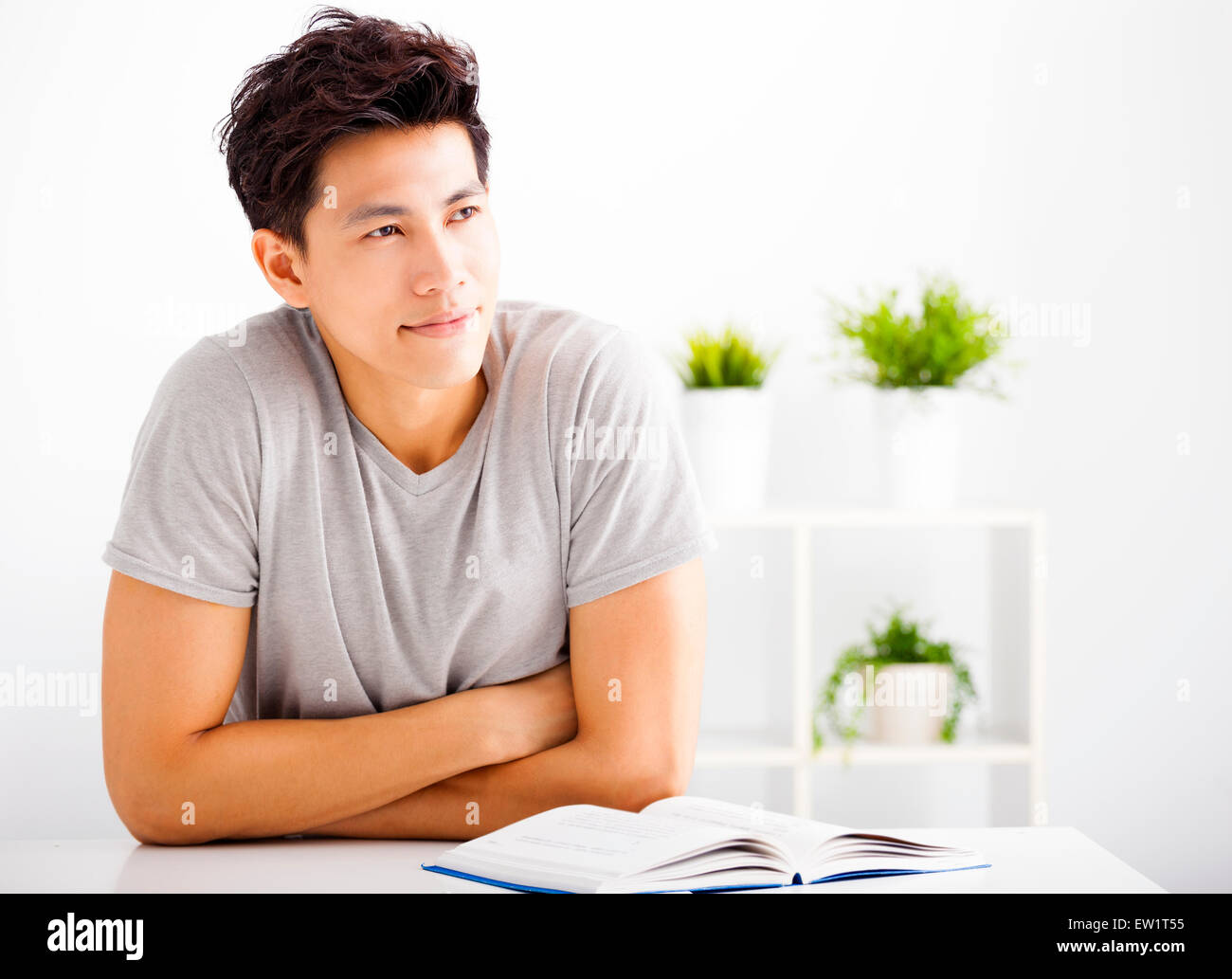 Interior with young man reading hi-res stock photography and images - Alamy