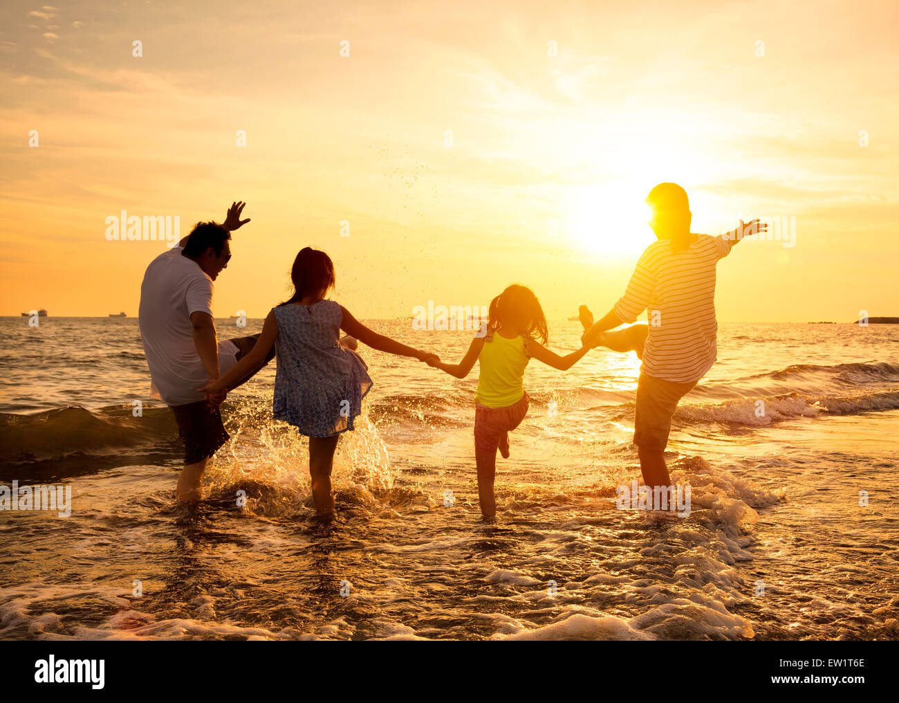 happy family enjoy summer vacation on the beach Stock Photo - Alamy