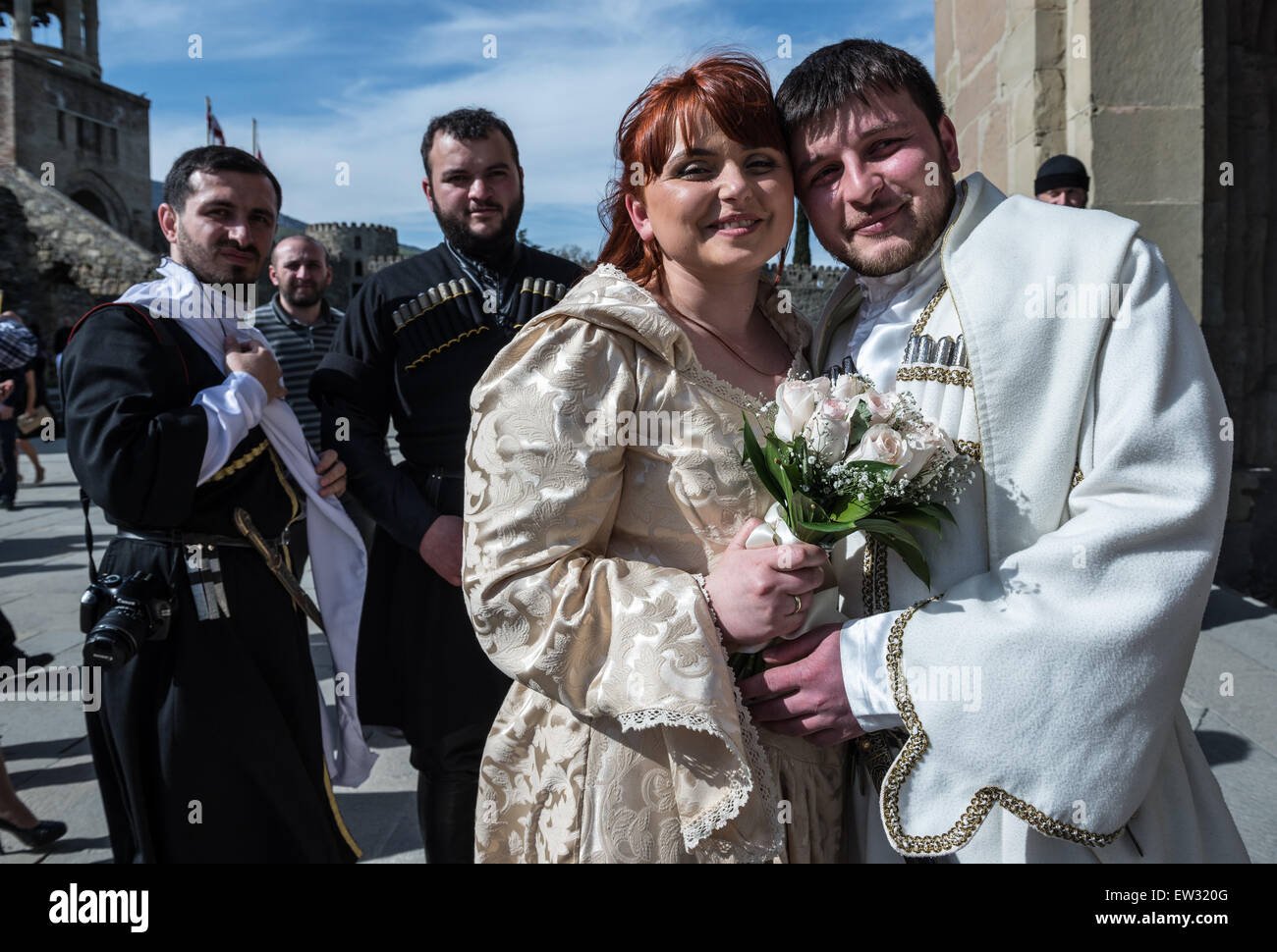 Wedding couple in traditional national costumes in Georgian Orthodox ...