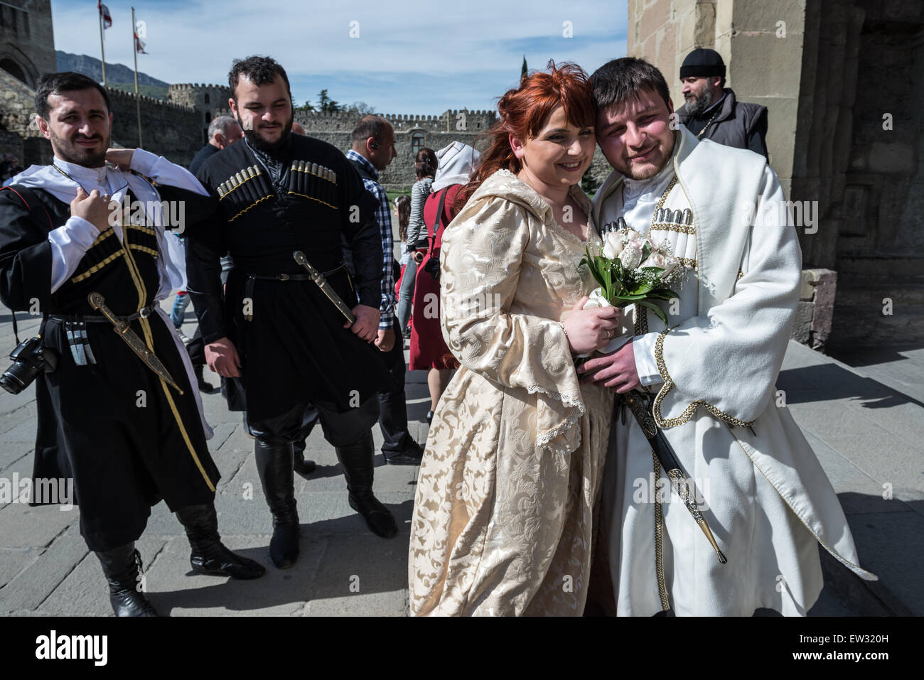 Wedding couple in traditional national costumes in Georgian Orthodox ...