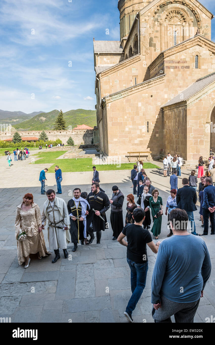Wedding couple in traditional national costumes in Georgian Orthodox ...