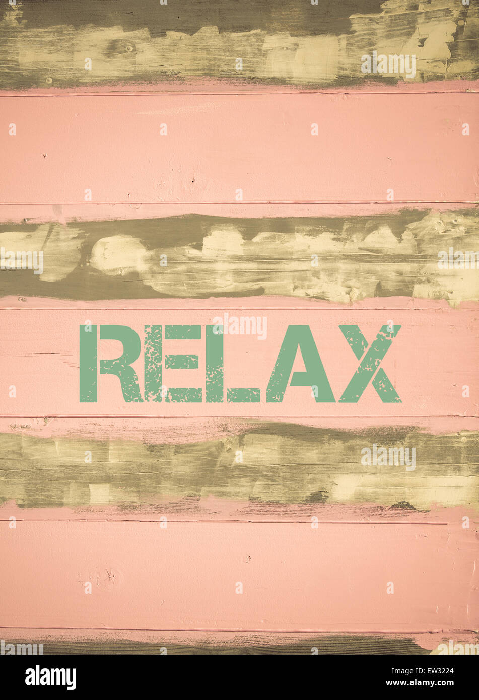Concept image of RELAX word written on vintage painted wooden wall ...