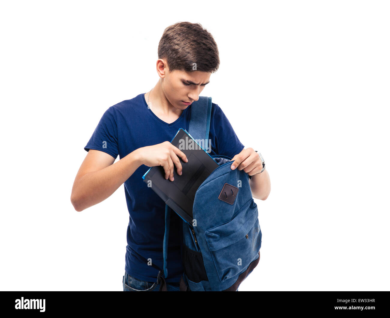 Male student putting folder in backpack isolated on a white background ...