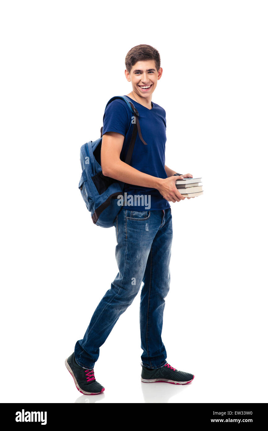 Full length portrait of a smiling male student holding books isolated ...