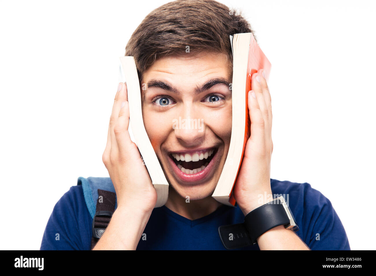 Closeup portrait of a funny man covering his face with books isolated ...