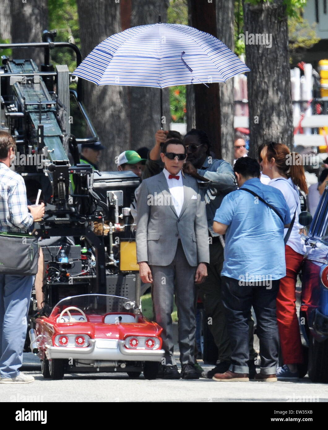 Paul Reubens puts on his famous red bow tie as he continues to film ...