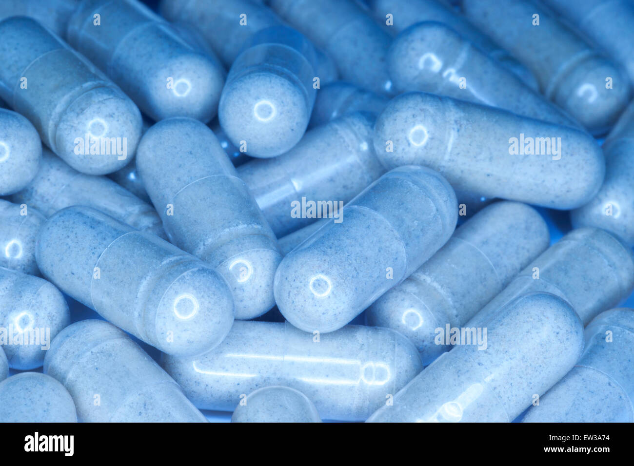 Generic medication capsules with bright circular catch lights in shades ...