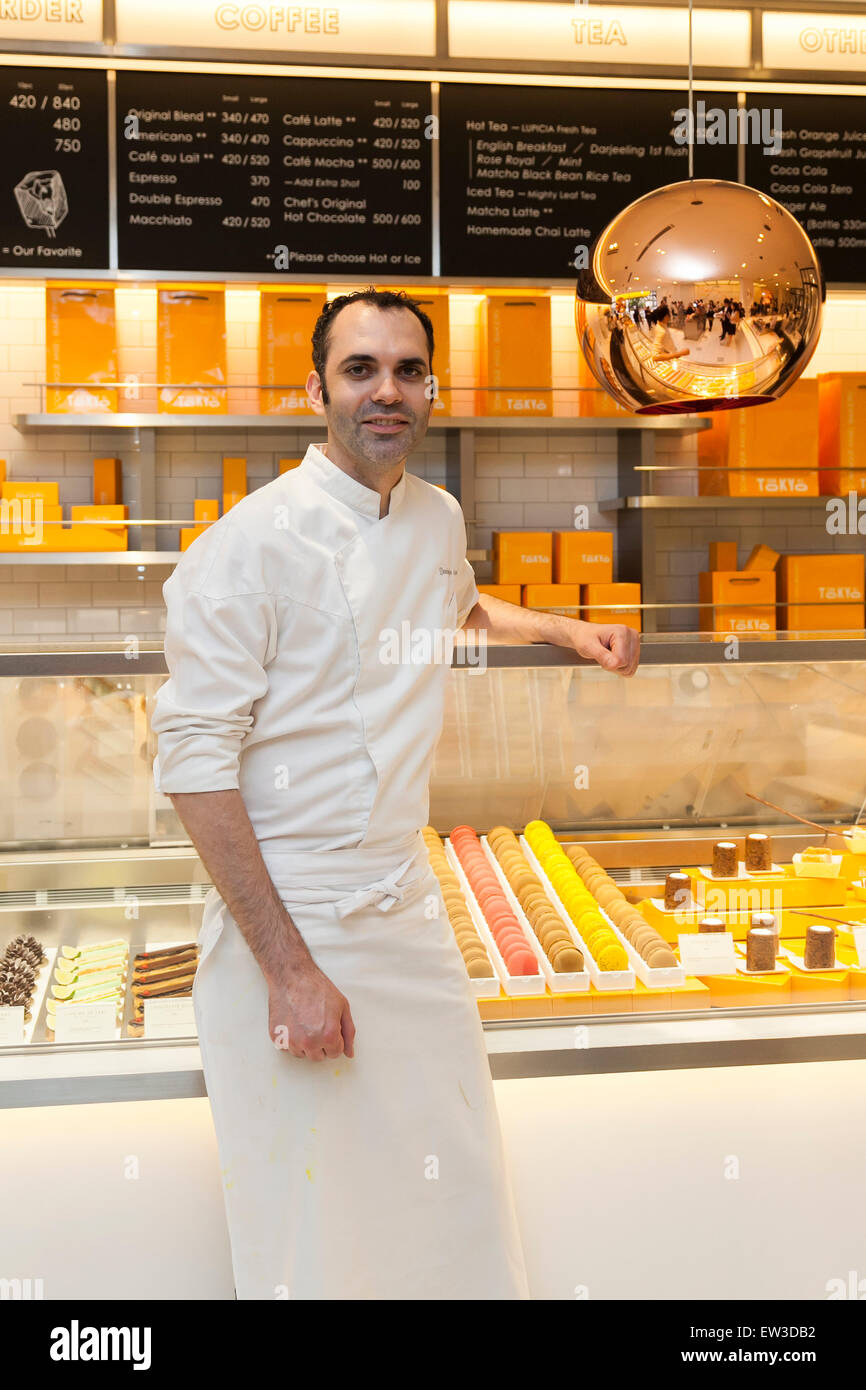 Chef Dominique Ansel poses for the cameras during the pre-opening event ...