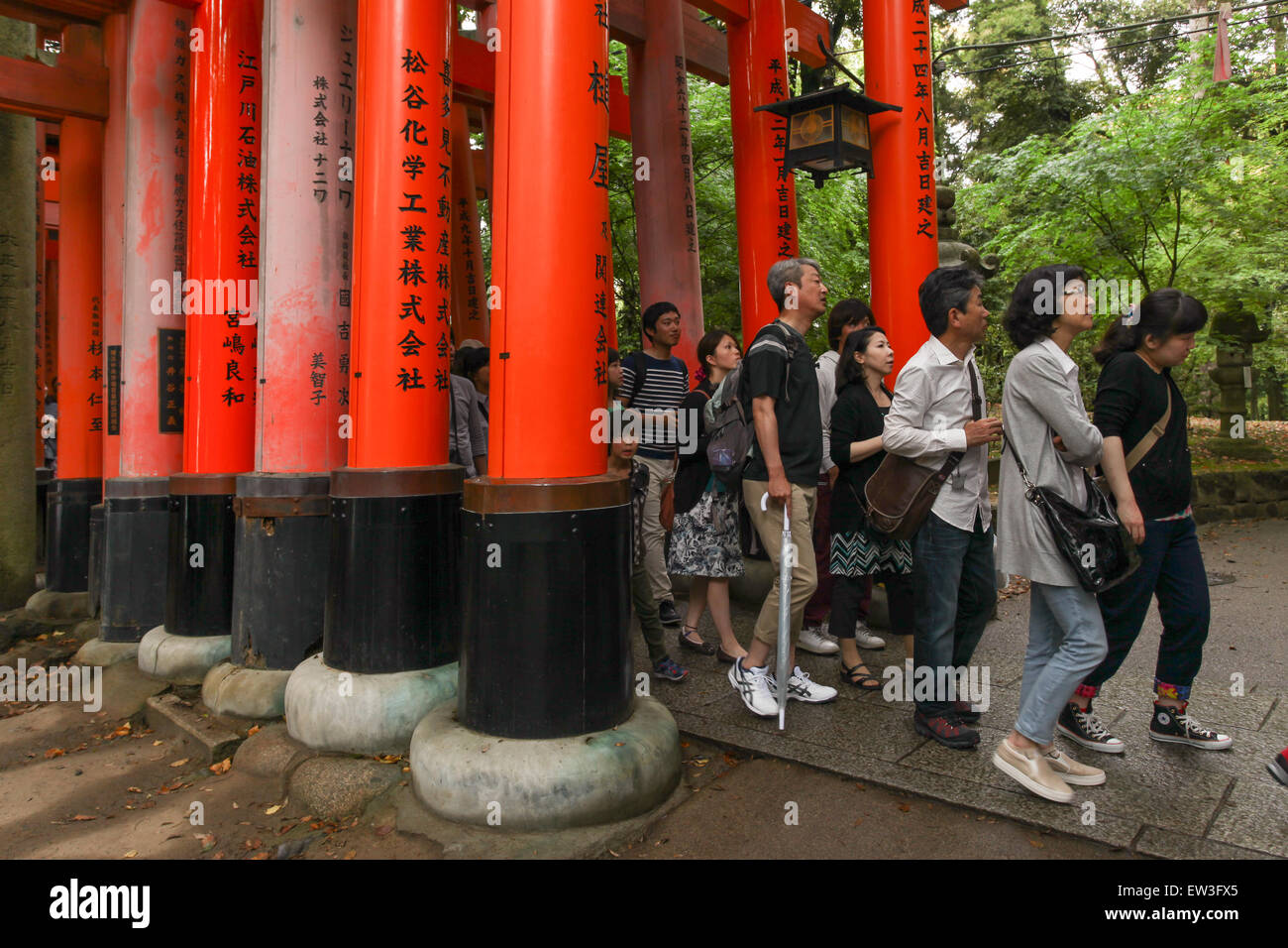 Japanese people and tourists enter Fushimi Inari Shrine in Kyoto Stock ...