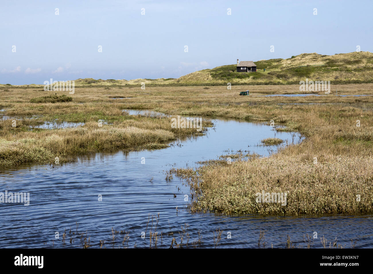 Looking over salt marsh to the Wardens cottage on Scolt Head Island ...