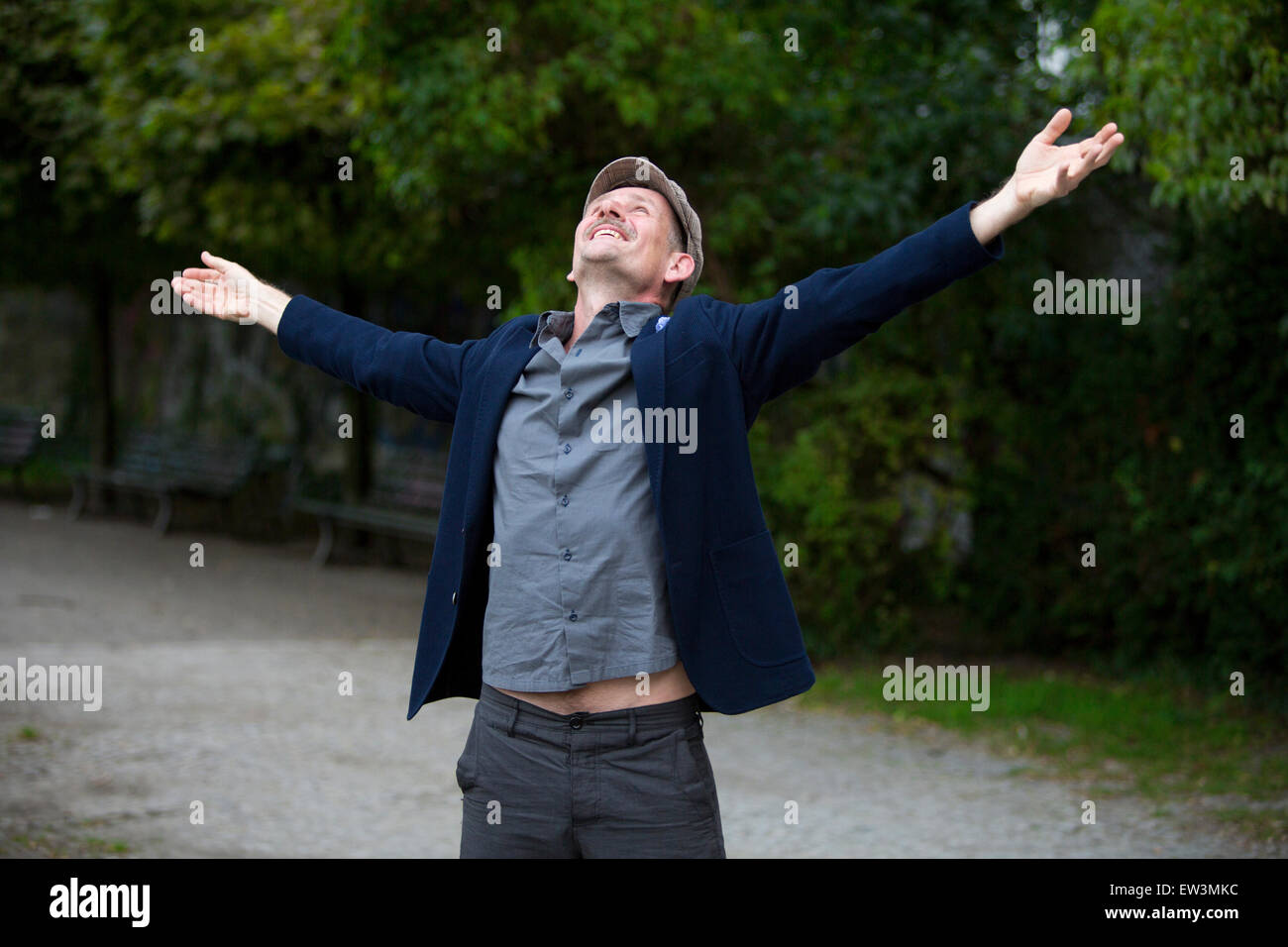 man standing in park and spreading his arms out of happiness Stock ...