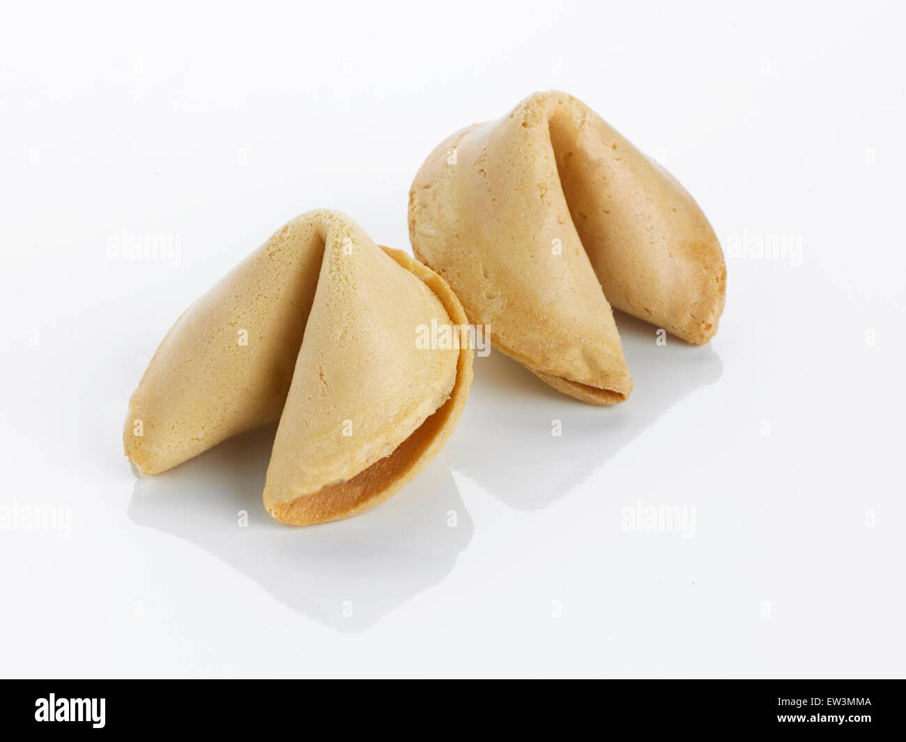 two unopened fortune cookies on a white background Stock Photo - Alamy