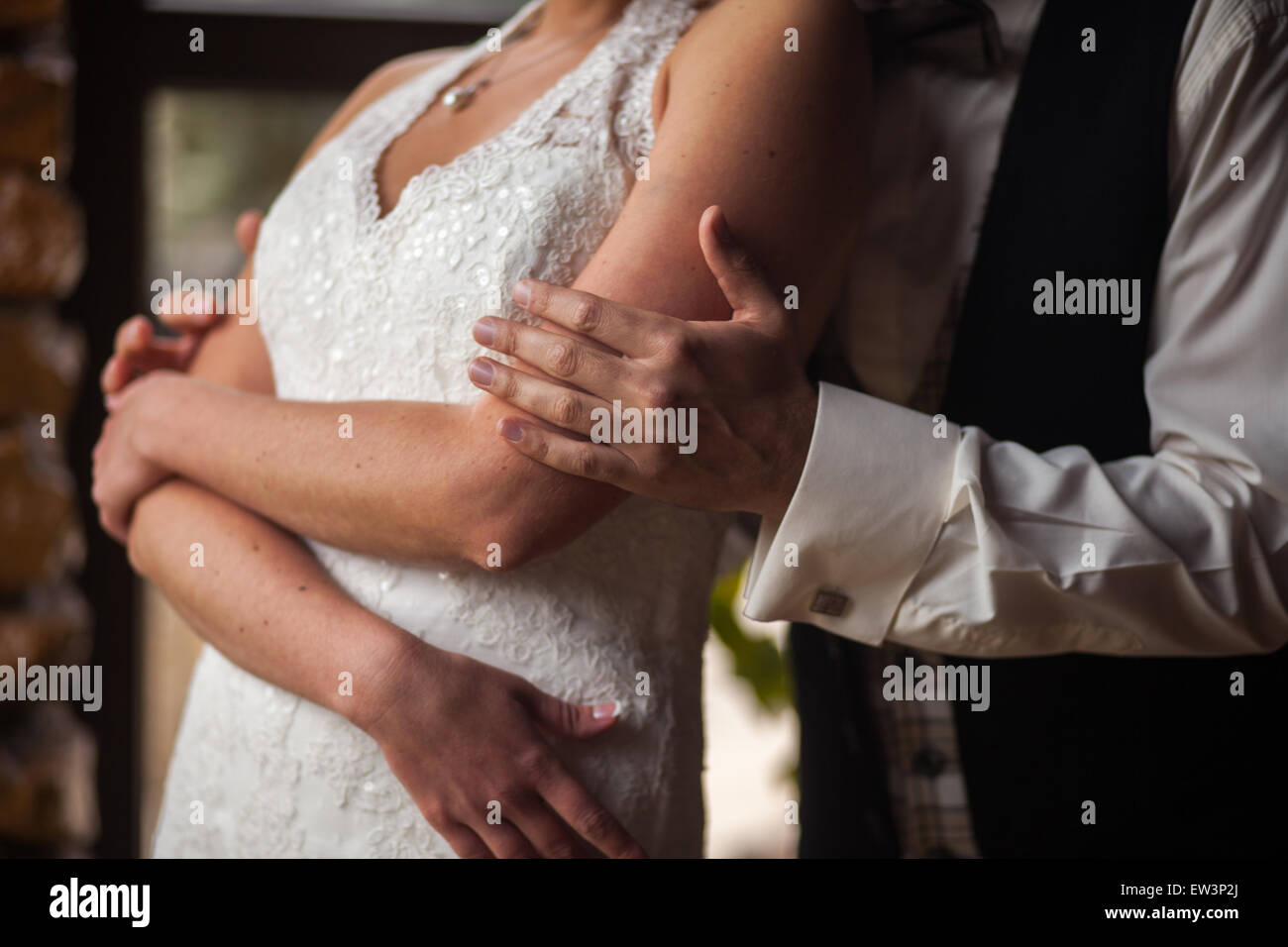 groom gently embraces the bride Stock Photo - Alamy