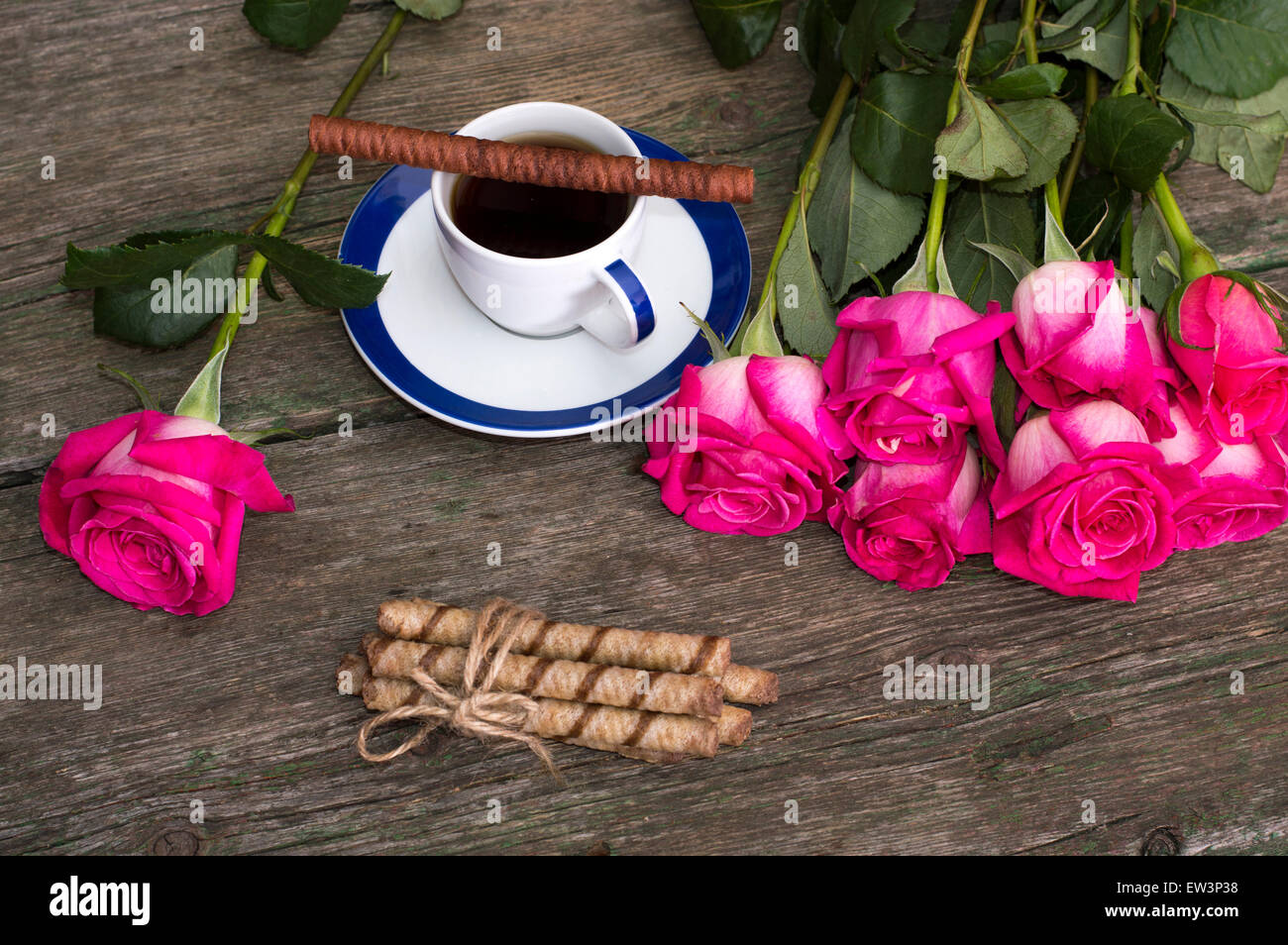 still life pink roses row coffee and cookies Stock Photo - Alamy