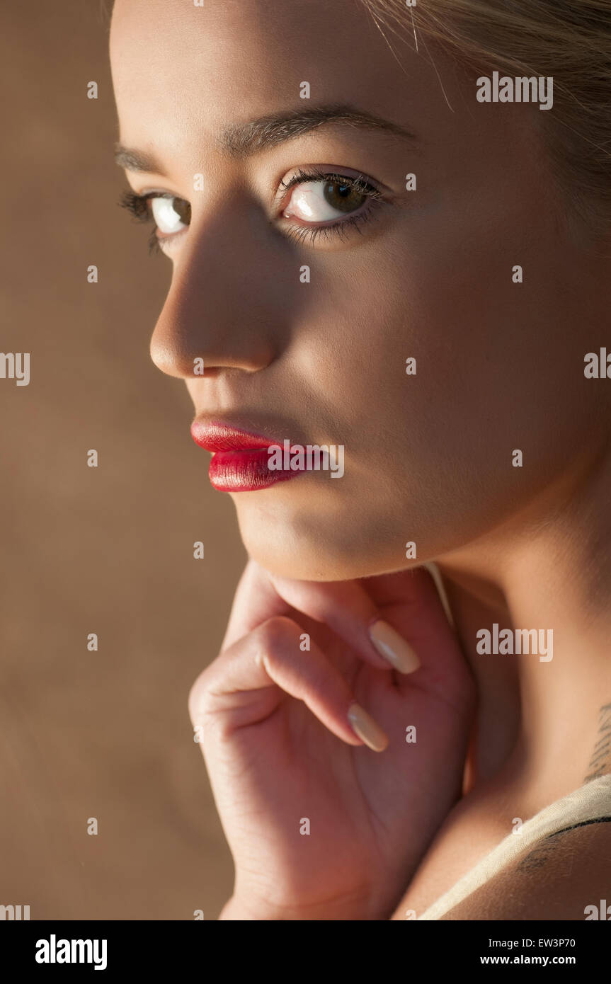Beautiful young woman staring Stock Photo - Alamy
