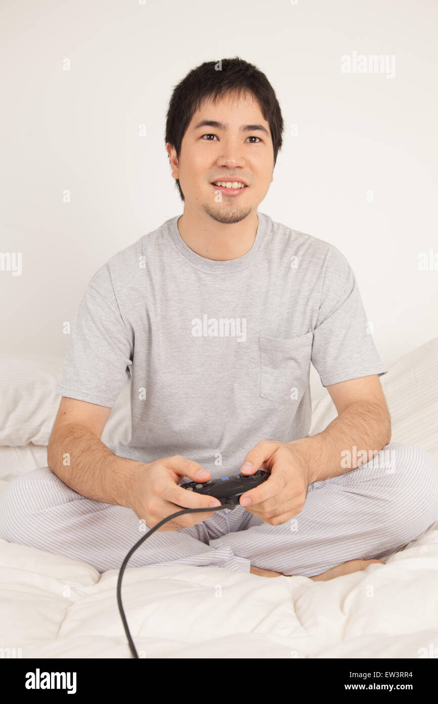 Young man in his bedroom Stock Photo - Alamy