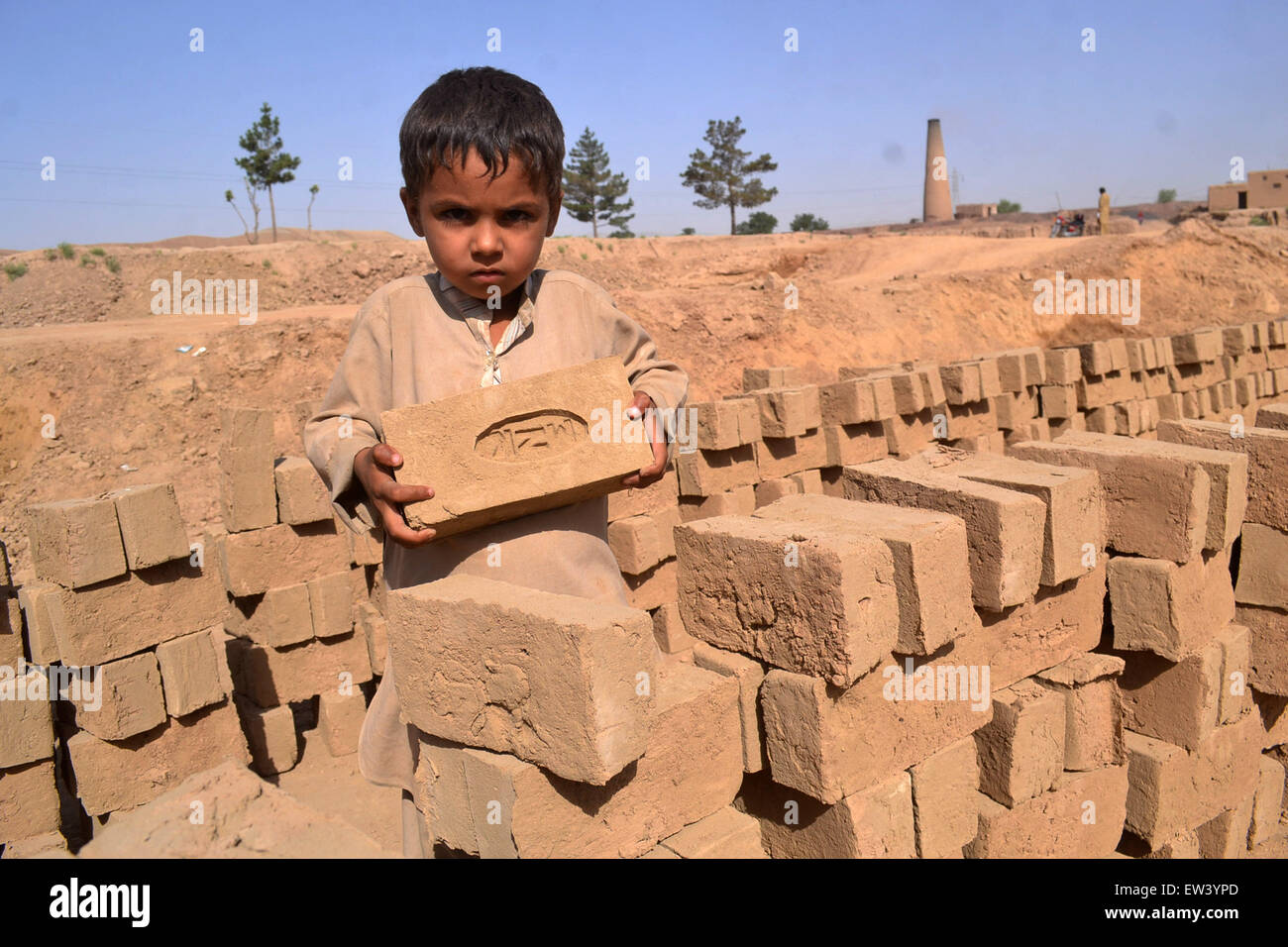 Quetta. 17th June, 2015. A Pakistani boy works at a brick factory in ...