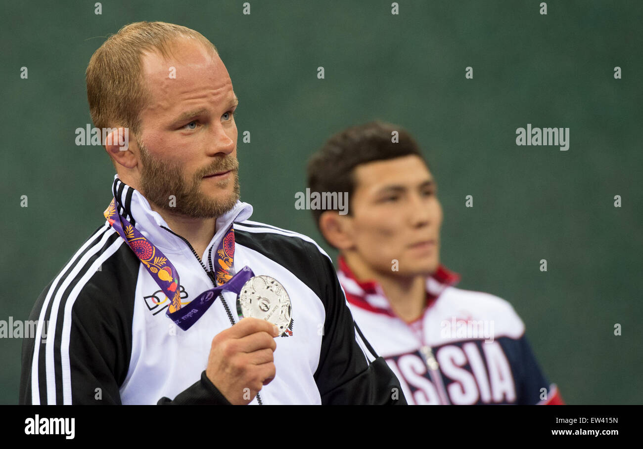 Baku, Azerbaijan. 17th June, 2015. Germany's Marcel Ewald (L) shows his ...