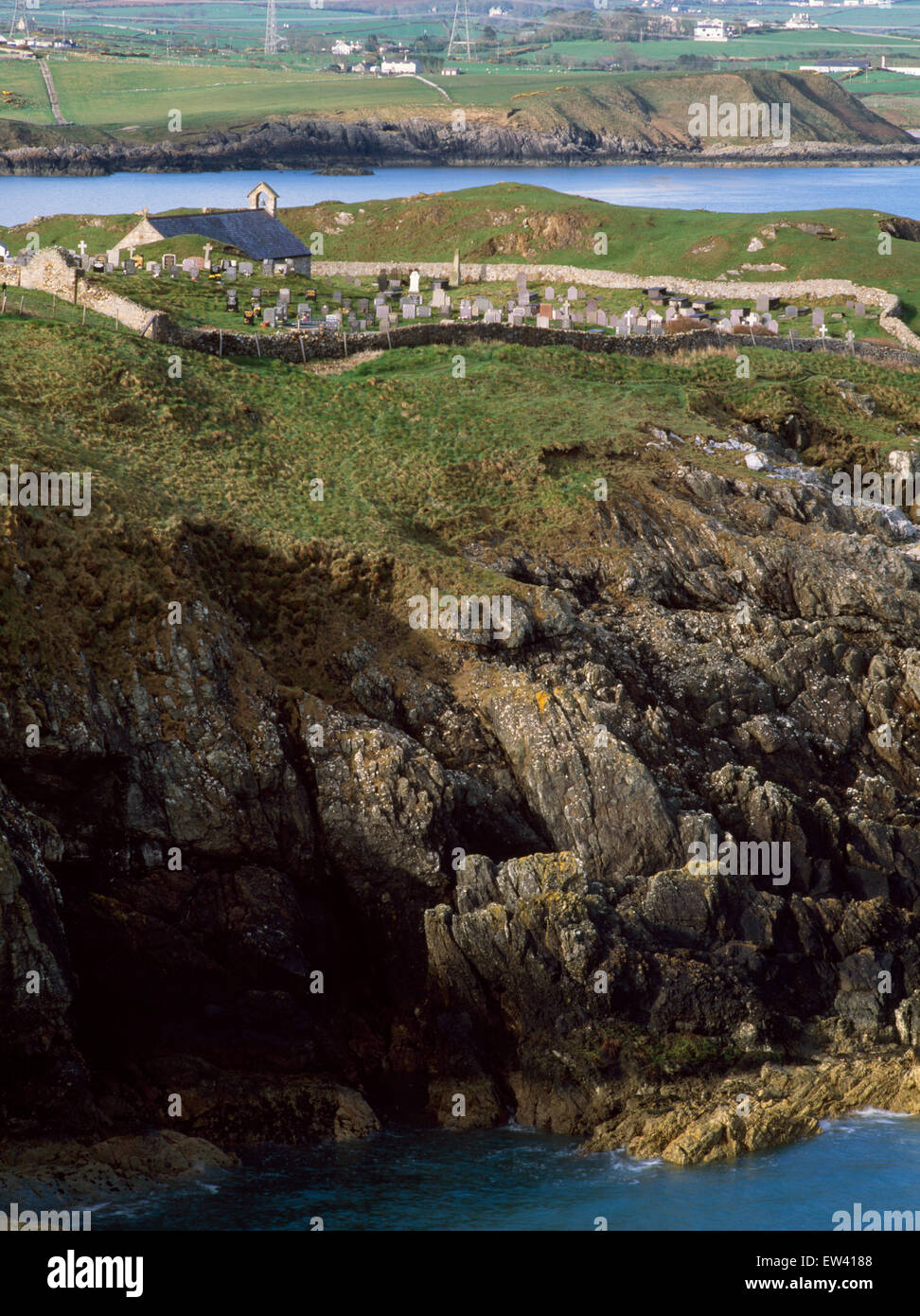 Looking west from the coastal path to Llanbadrig church, Cemaes in ...