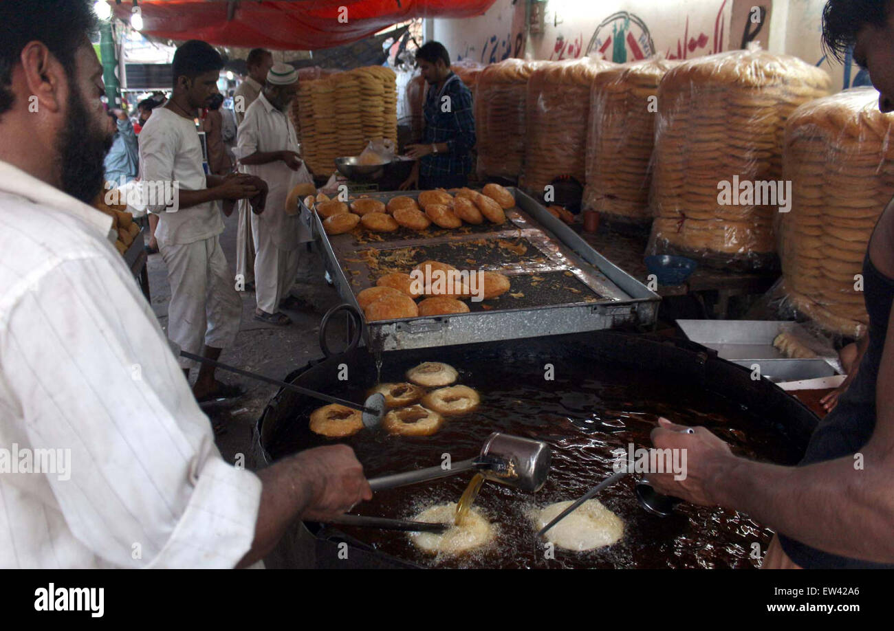 Bakers are frying “Khajla” a traditional meal used with milk during ...