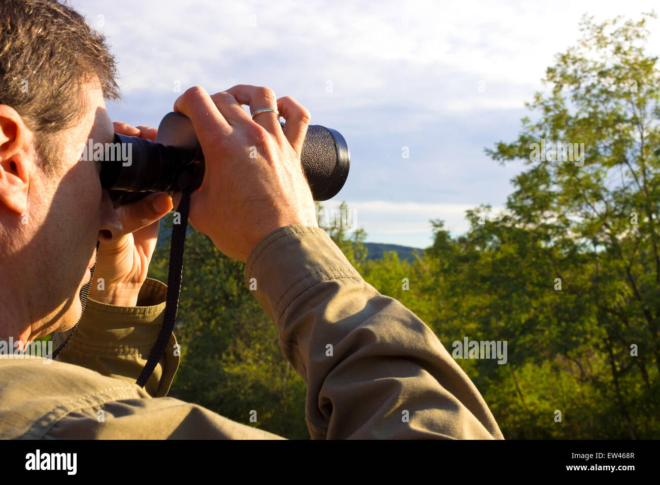 Man with binoculars Stock Photo - Alamy