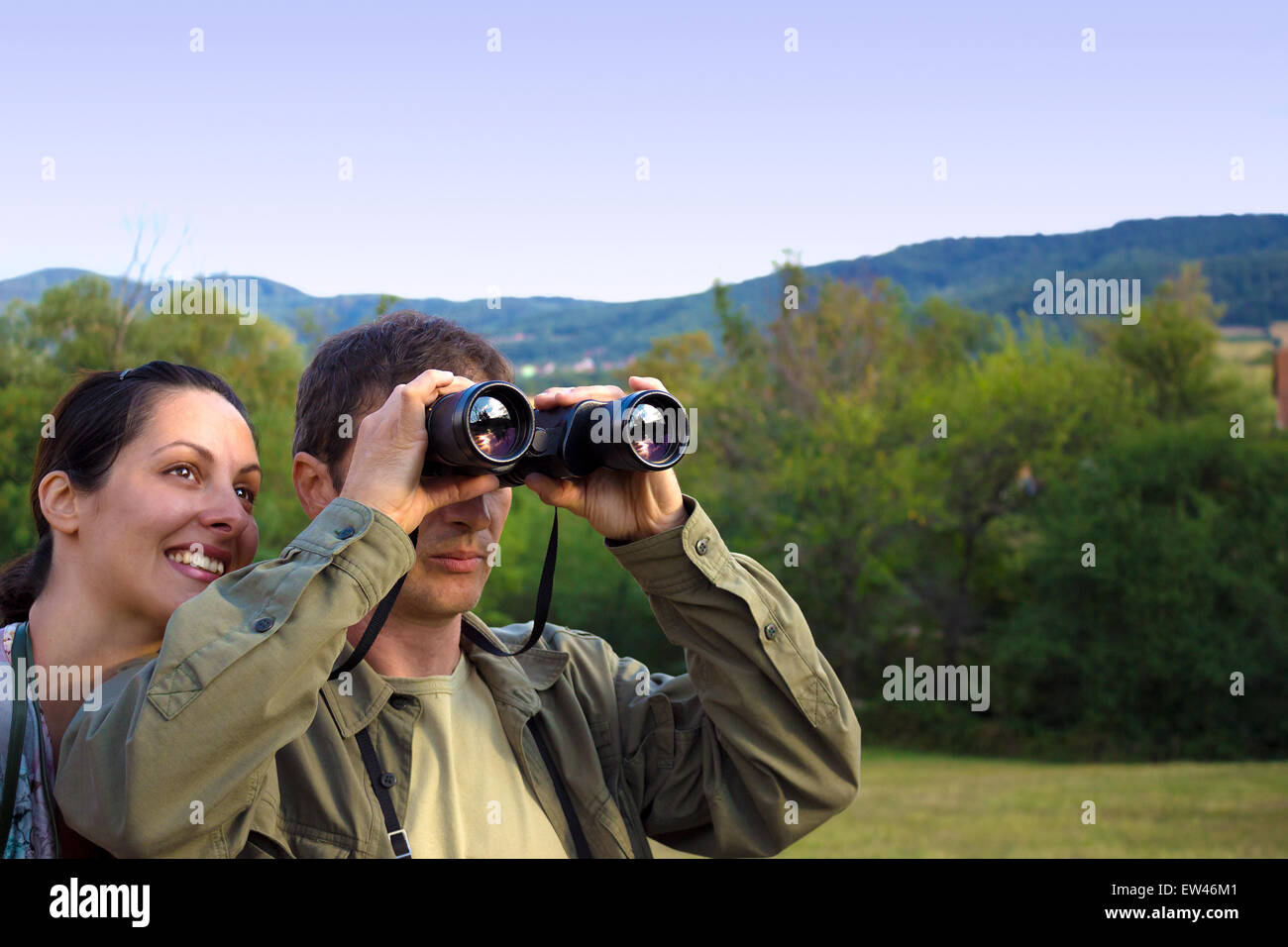 Birdwatching with binoculars Stock Photo - Alamy