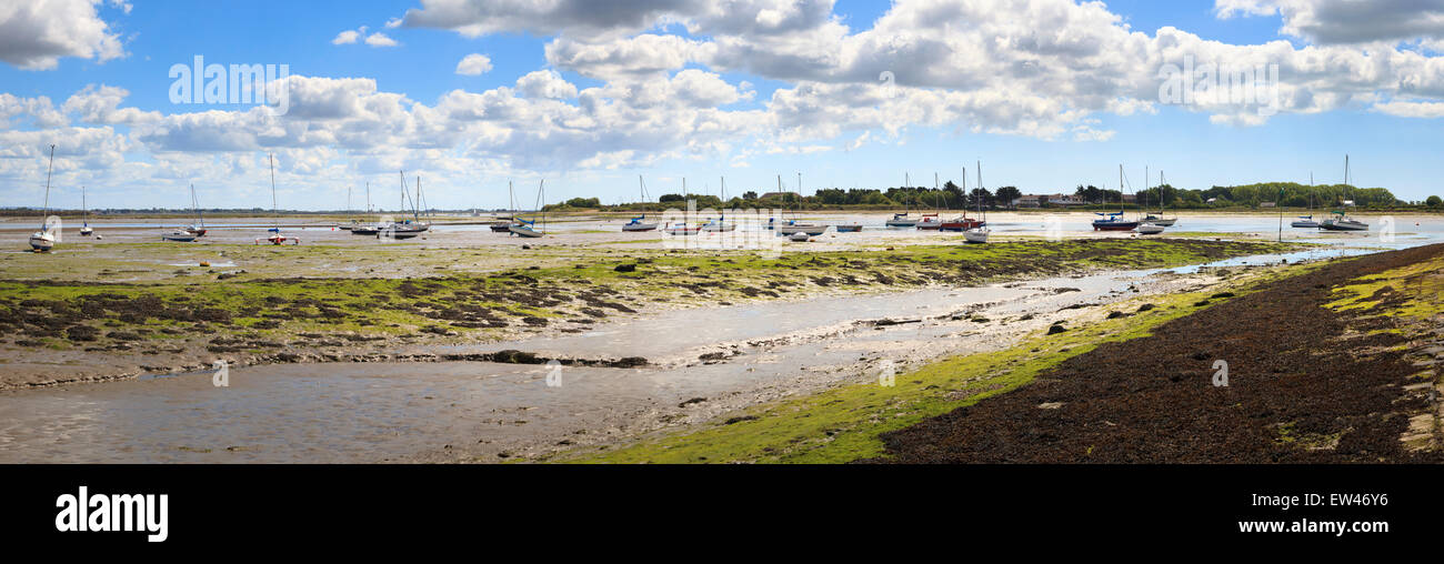 Extreme panorama of Low tide mud flats with yachts at Langstone Harbour ...