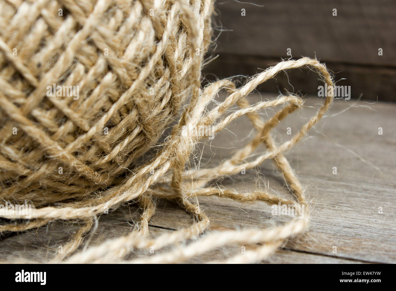 wool ball of threads on wooden table Stock Photo - Alamy