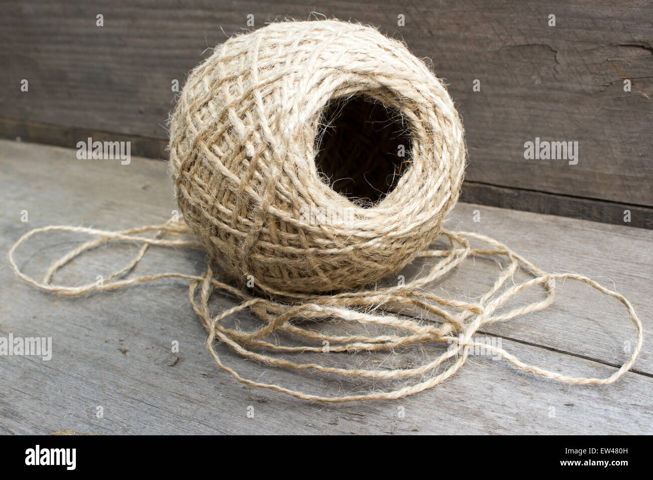 wool ball of threads on wooden table Stock Photo - Alamy