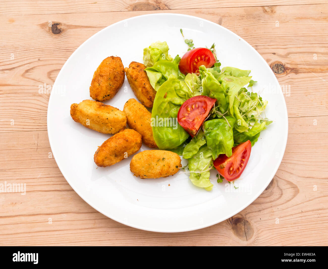 Cod Croquettes classic Brazilian or Portuguese dish served with salad ...