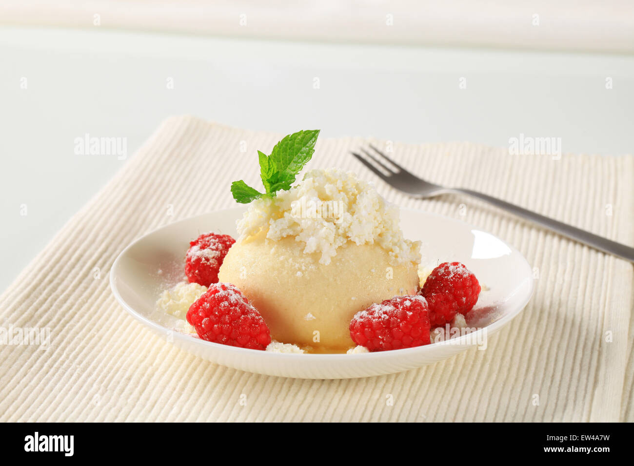 Raspberry dumpling with cottage cheese, sugar and butter Stock Photo ...