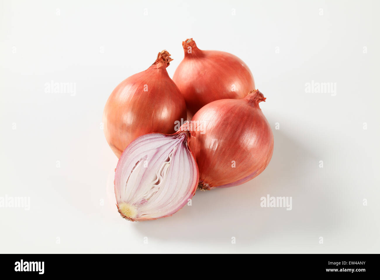 Raw red onions - studio shot Stock Photo - Alamy