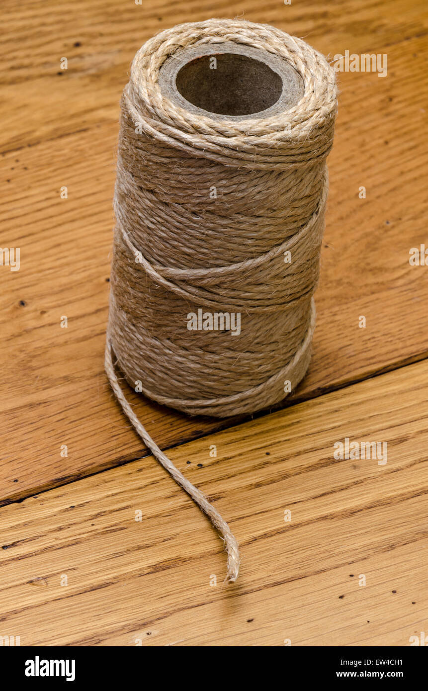 Ball of string on an oak top Stock Photo - Alamy