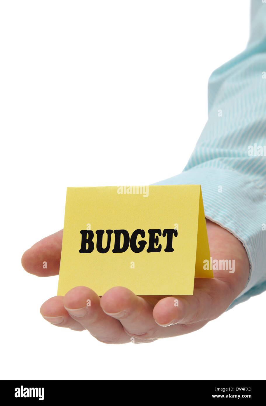 Business man holding yellow budget sign on hand Stock Photo - Alamy