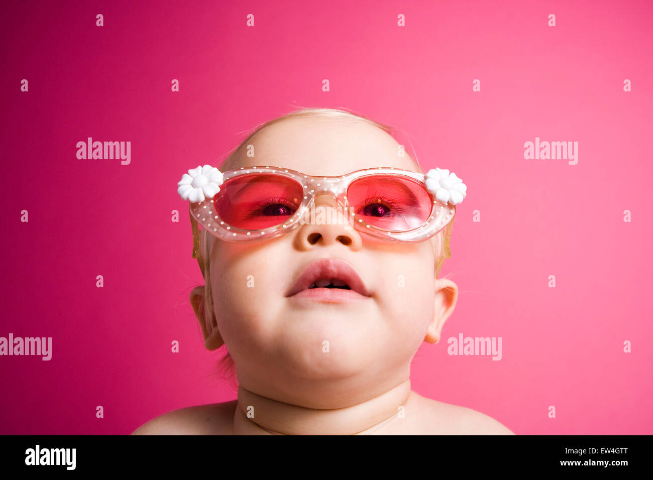 Portrait of a cute little girl wearing pink sunglasses Oceanside ...