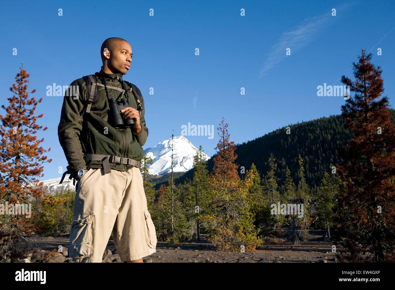 African American man Cupid Alexander stands in forest during hike near ...