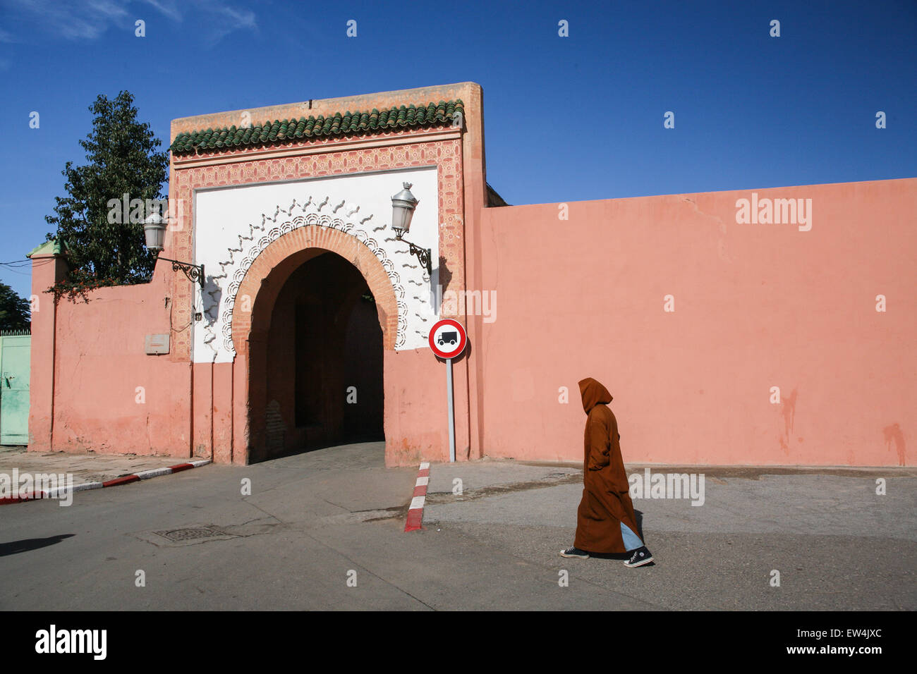 Local man wearing long-hooded cloak known as a djellaba, worn by both ...