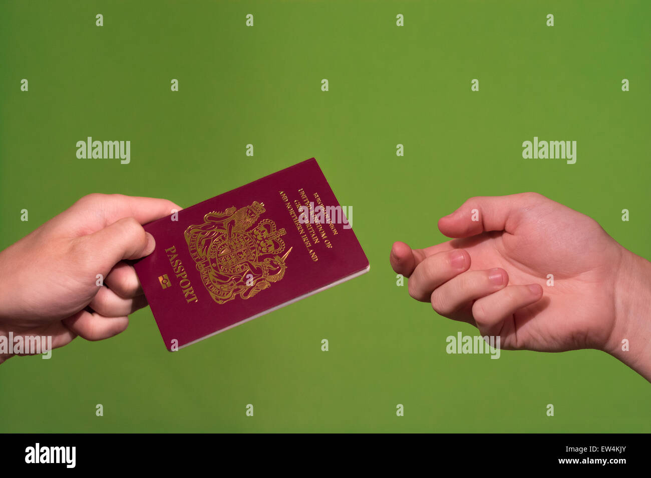 Hands exchanging a passport isolated on a green-screen background Stock ...