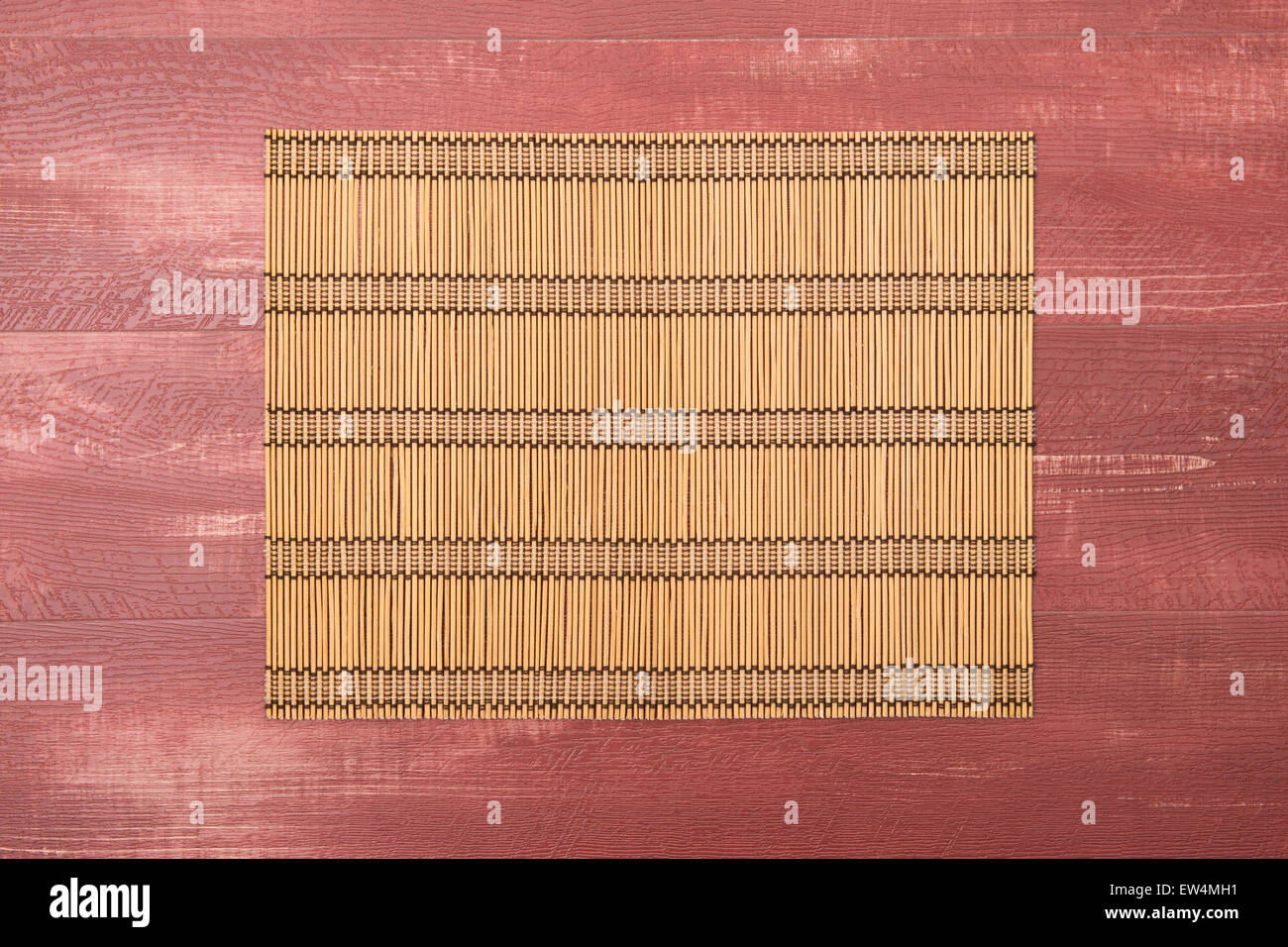 Bamboo place mat on wooden deck table Stock Photo - Alamy